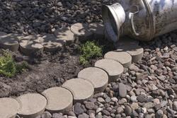 2-3/8 x 5-3/4 x 4-3/8 Gray Crescent Edger Block at Menards®