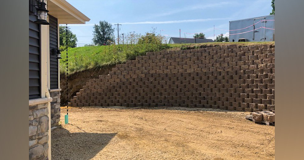 Pillars At Driveway With Retaining Wall